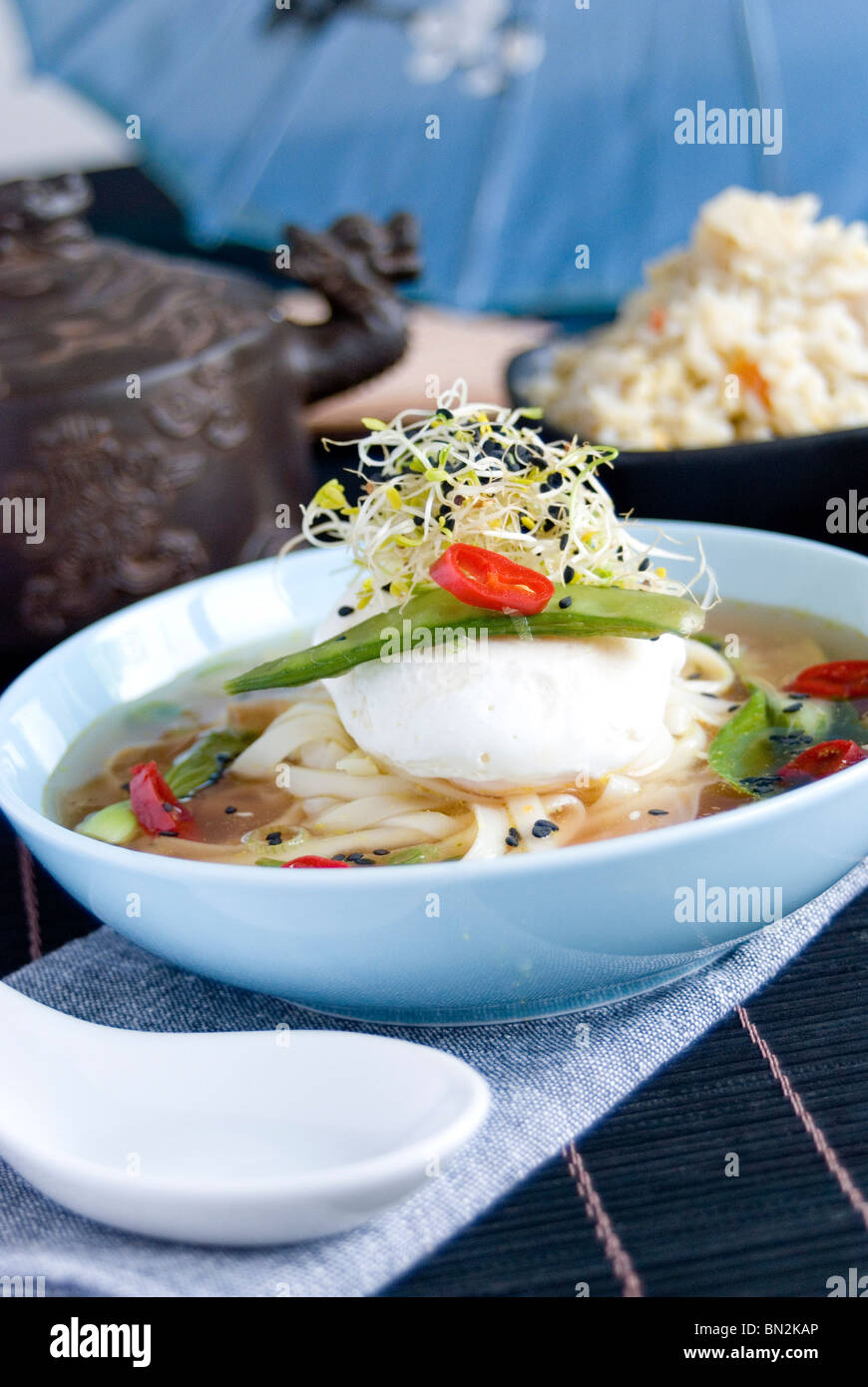 Chinese broth with poached egg Stock Photo - Alamy