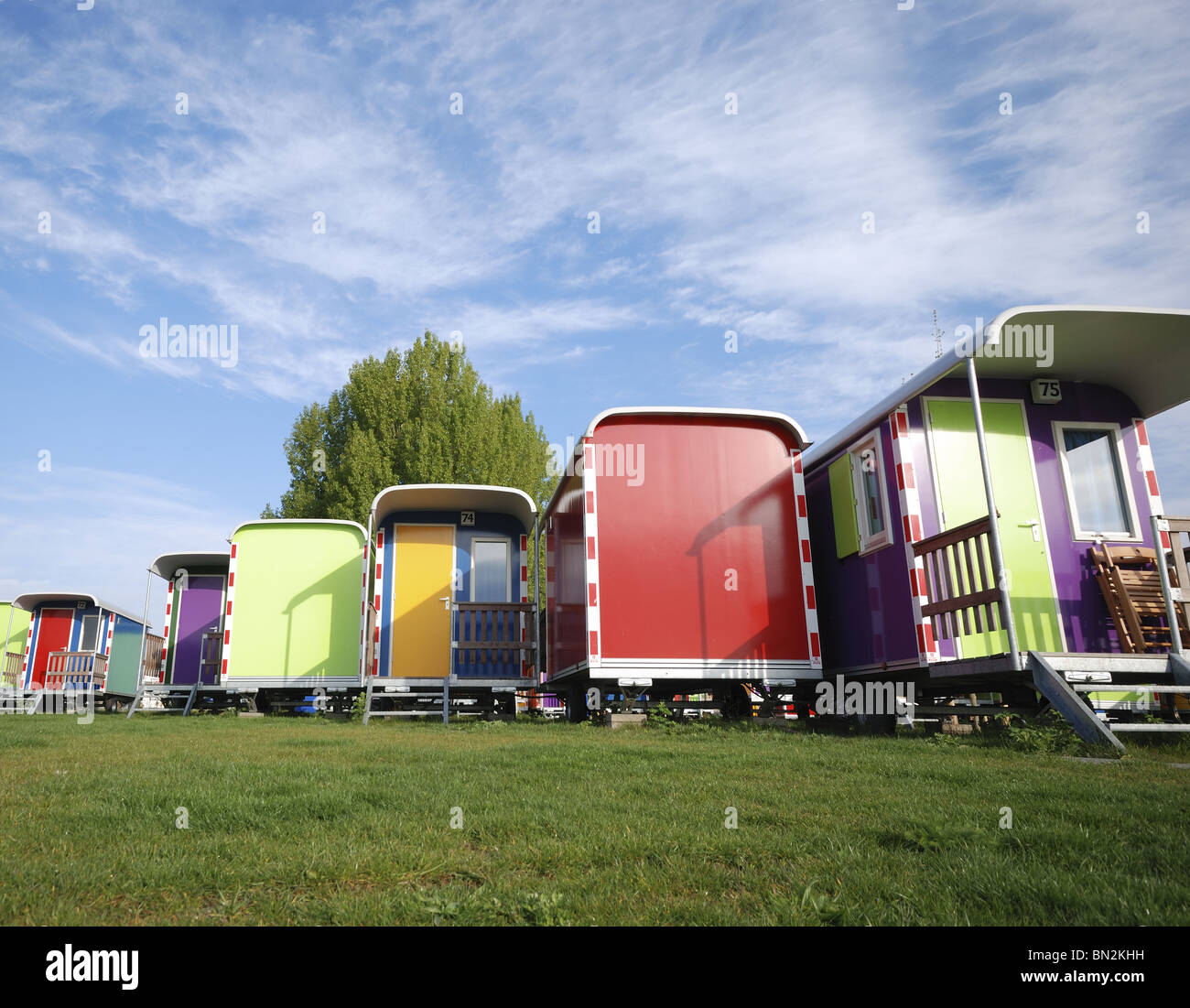 Multi color caravans against blue sky Stock Photo - Alamy