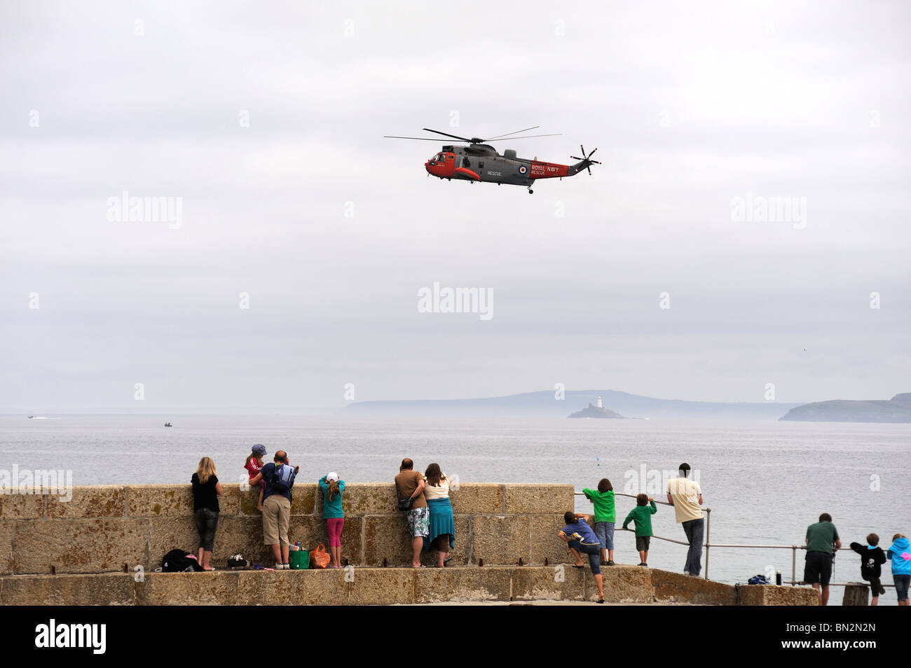 A Royal Navy Rescue helicopter doing practice manoeuvres in front of ...