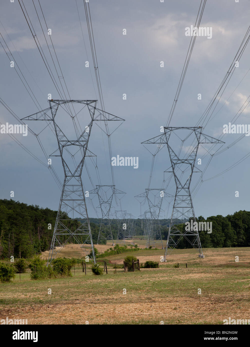 Large metal electricity pylons march across the countryside Stock Photo ...