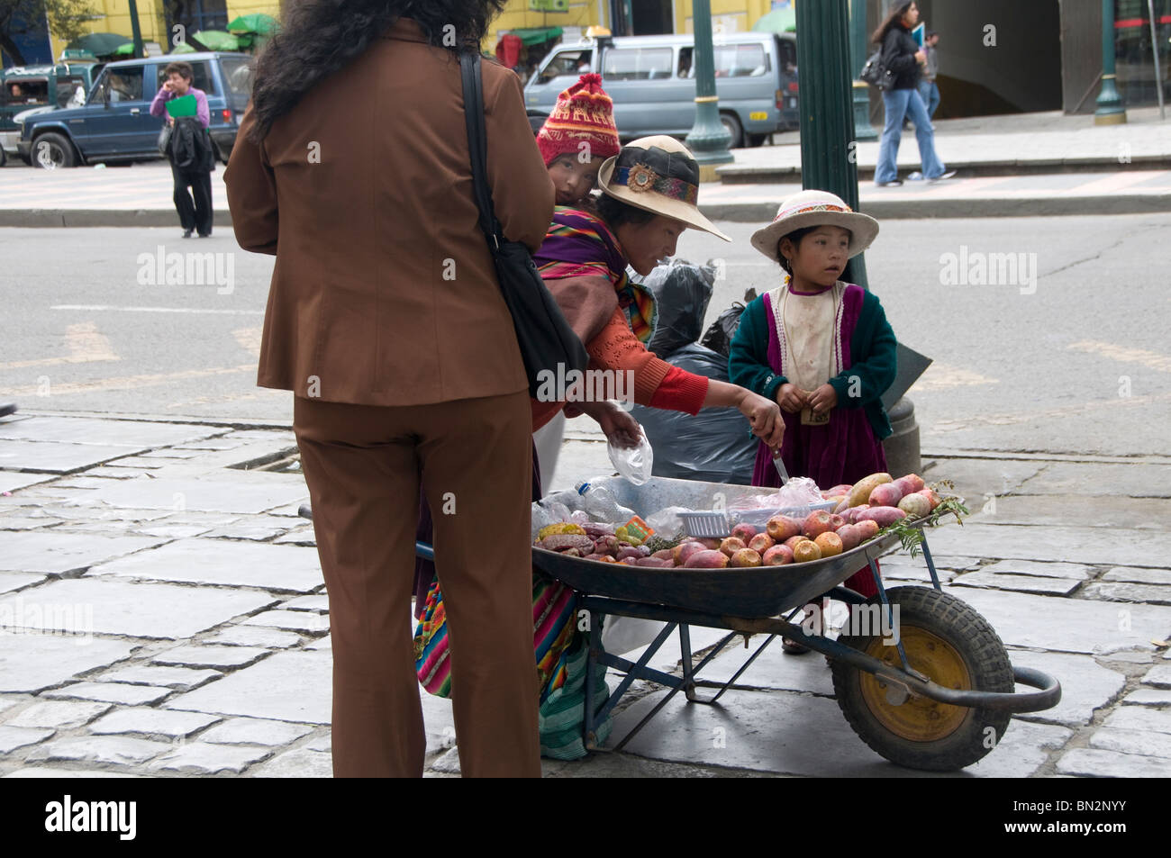 Woman baby on back selling hi-res stock photography and images - Alamy