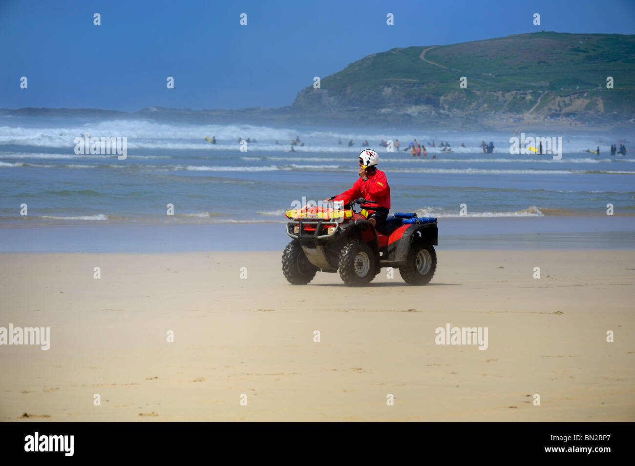 Lifeguard patrolling the beach on a quad bike Stock Photo - Alamy