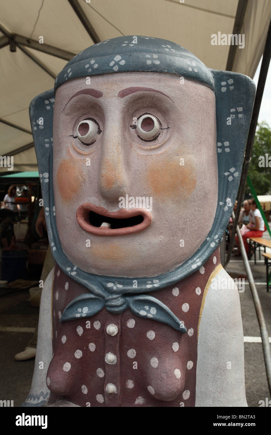 Funny human character made from clay on display at the pottery craft ...
