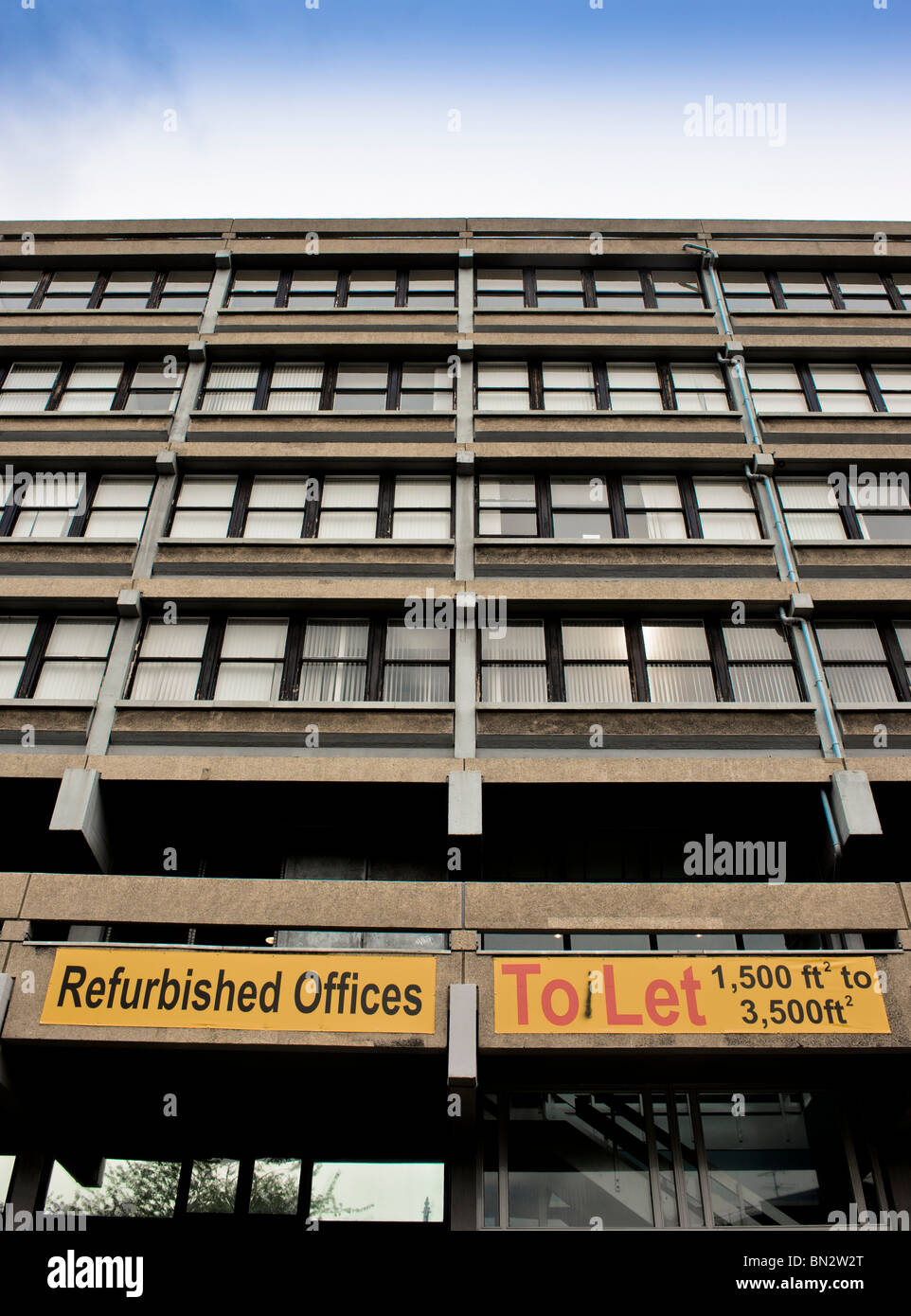 Refurbished offices To Let - signs on outside of empty office block ...