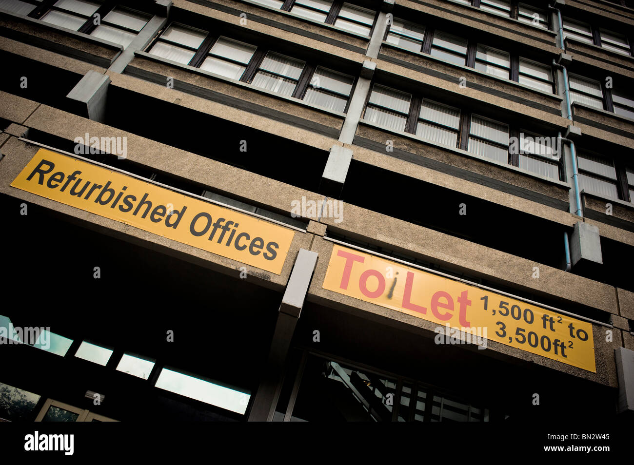Refurbished offices To Let - signs on outside of empty office block ...