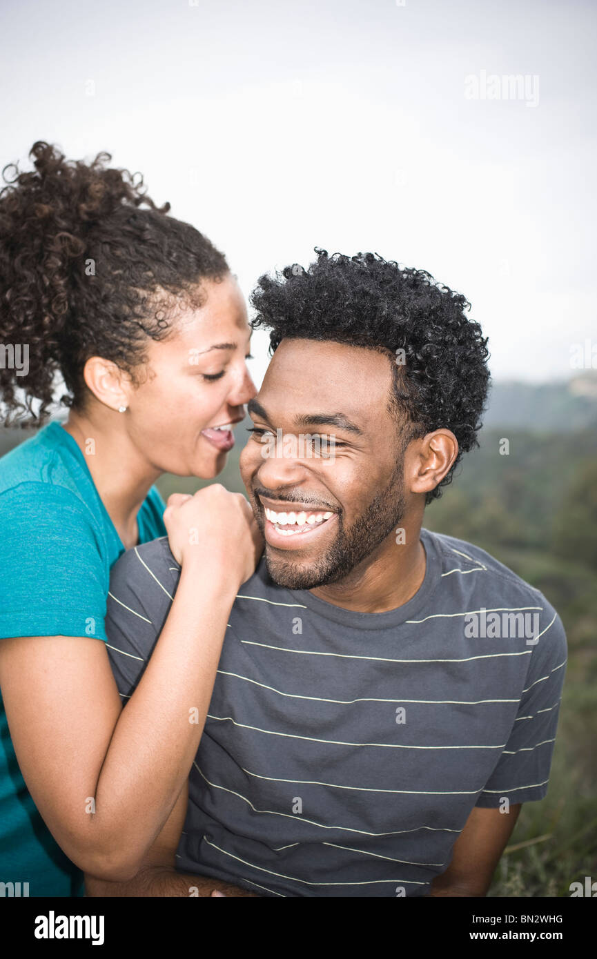 Girlfriend telling boyfriend secrets Stock Photo - Alamy