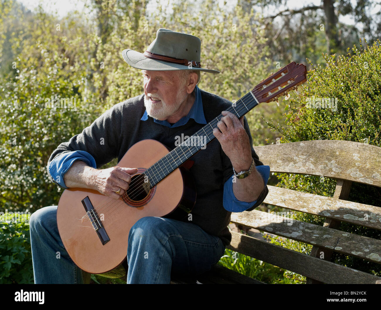 OLDER MAN PLAYING CLASSICAL GUITAR OUTDOORS Stock Photo - Alamy