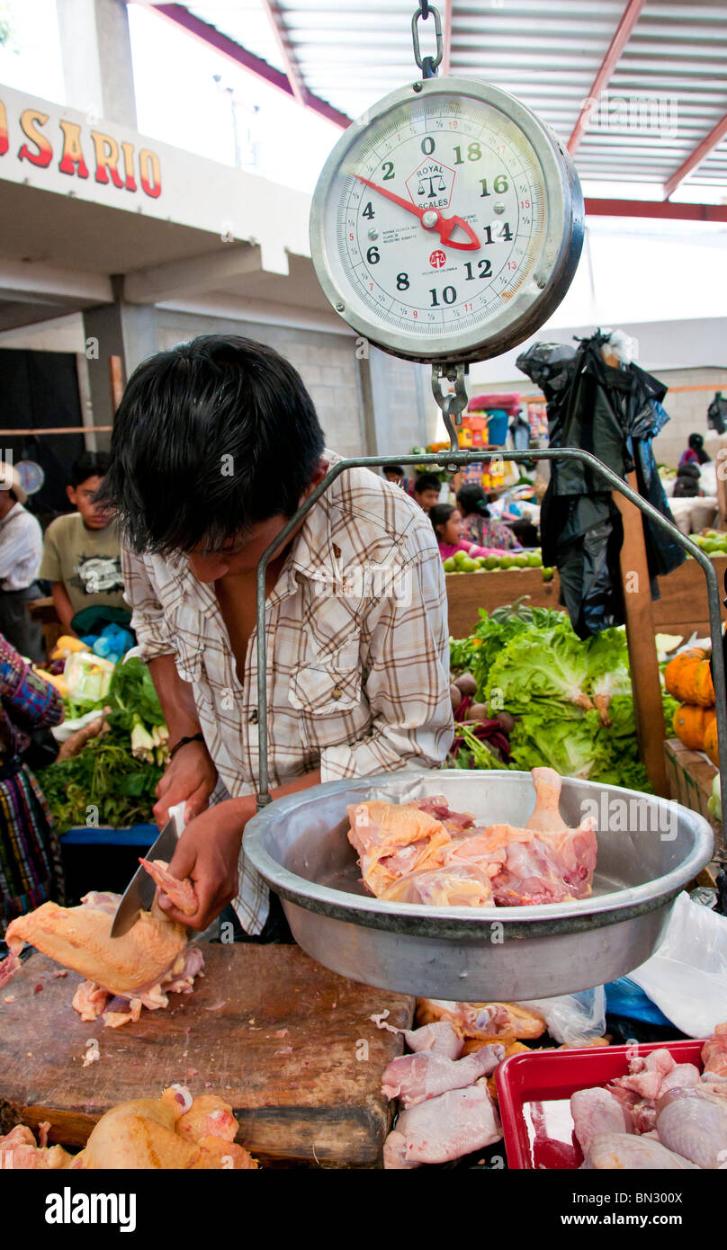 Panajachel Market Chicken vendor Stock Photo - Alamy