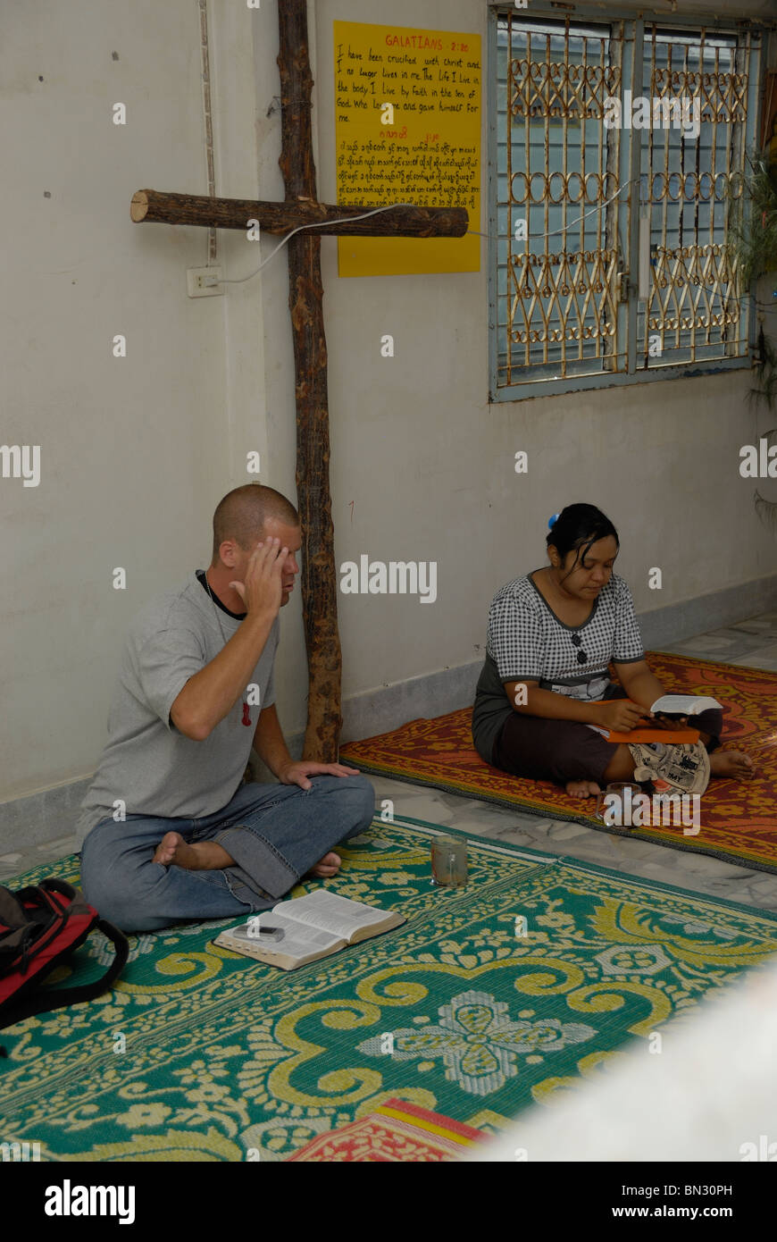 Burmese people listening a pastor in a church in Baan Nam Khen village ...