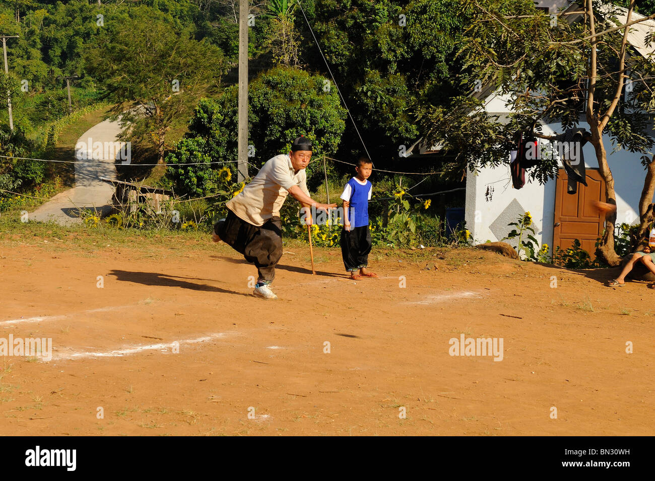 Children playing spinning tops hi-res stock photography and images - Alamy
