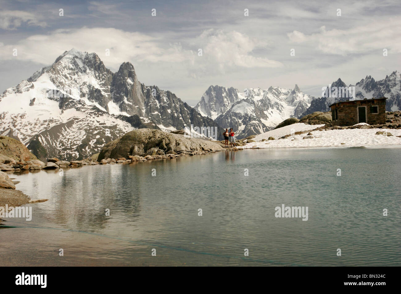 Tourists on Lac Blanc Lake, in the Mont Blanc Massif, near Chamonix ...