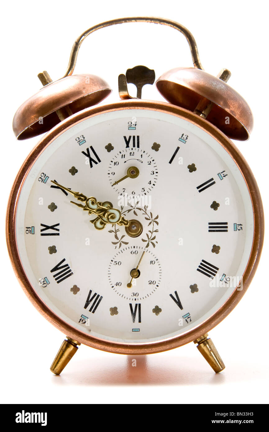 cooper alarm clock over white background Stock Photo - Alamy