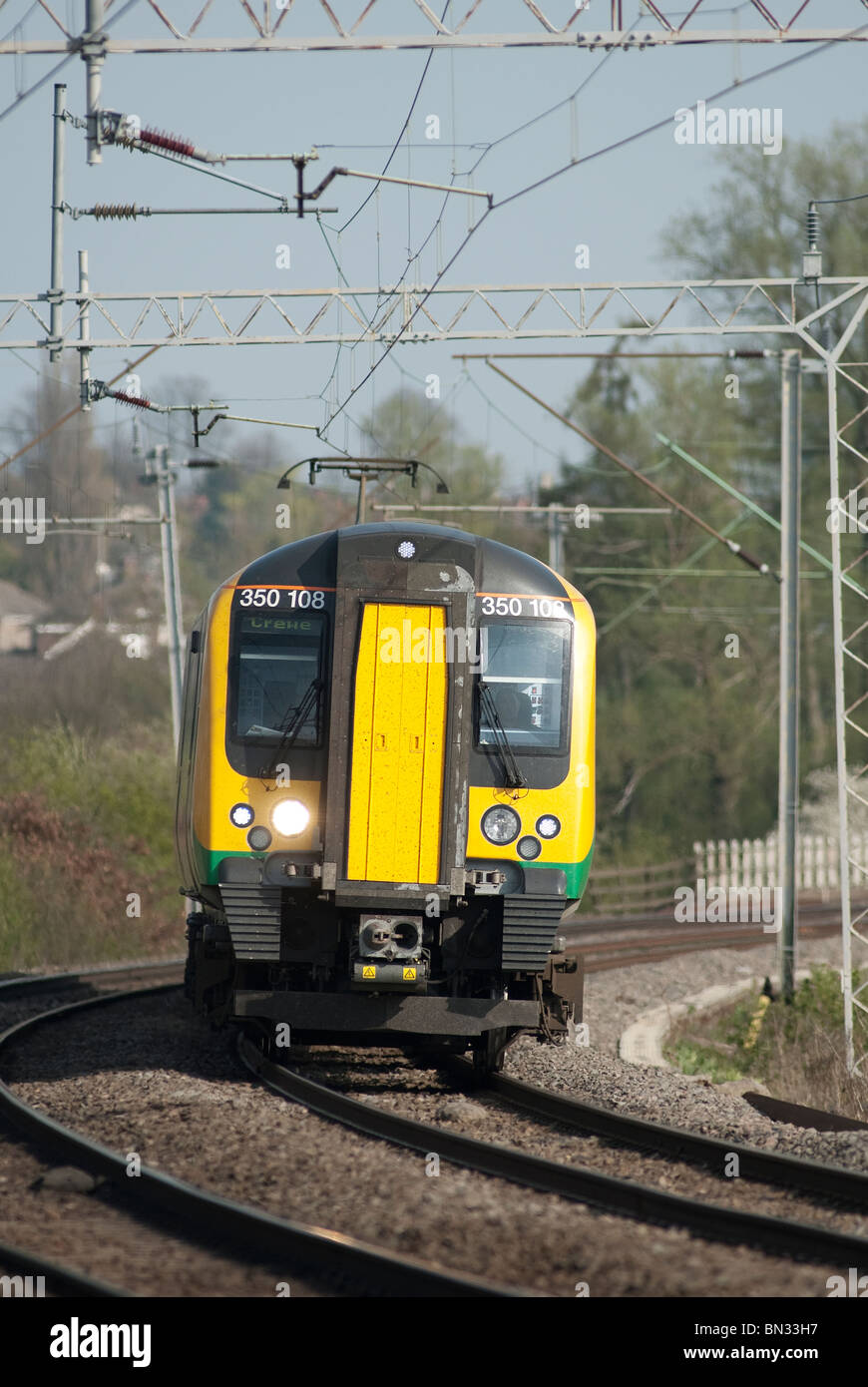 London Midland trains passenger train class 350 travelling at speed ...