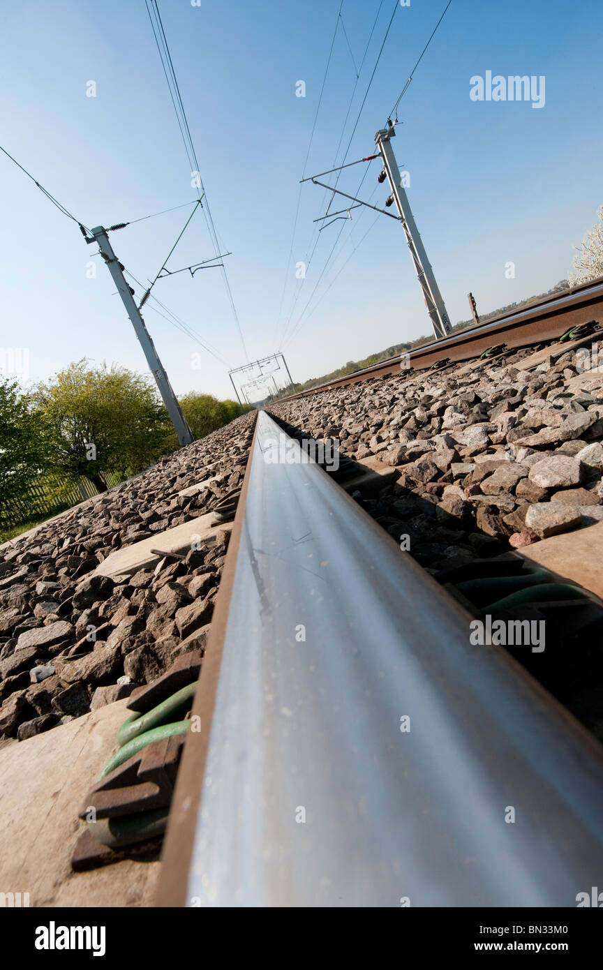 Low down view of empty railway track stretching into the distance Stock ...