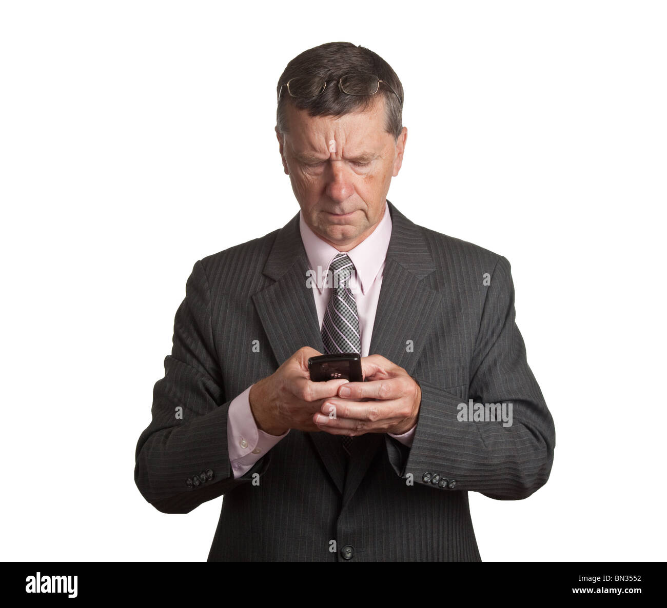 Middle aged man squinting at smart phone Stock Photo - Alamy