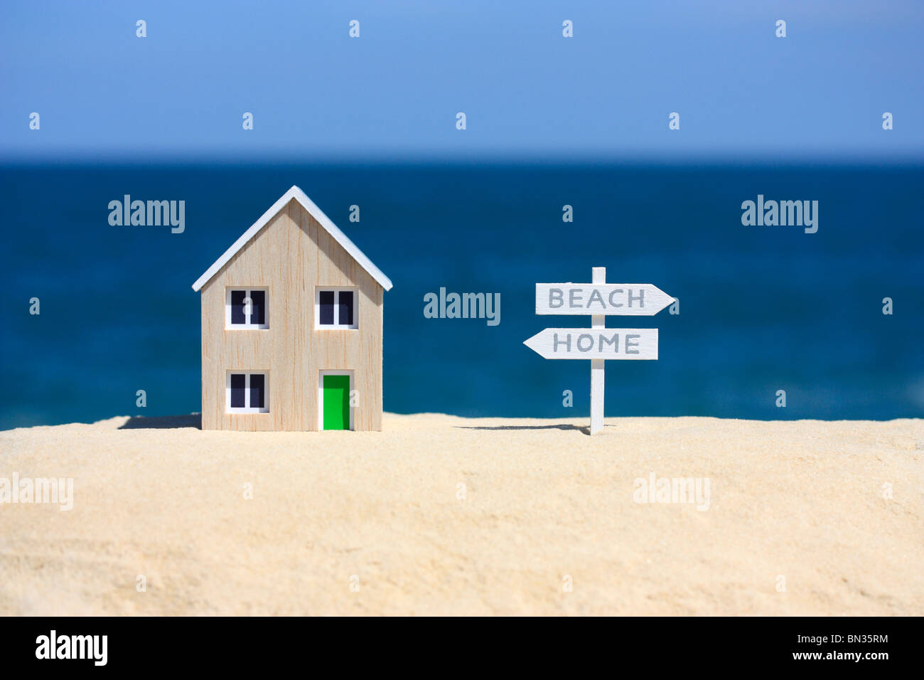 Model house and signpost Stock Photo - Alamy