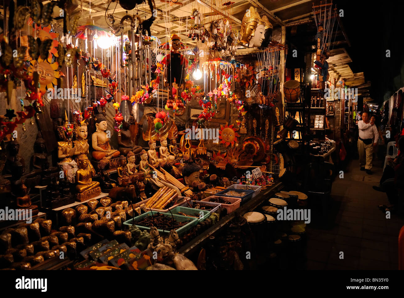 Booth selling goods for tourists at night in a street in Chiang Mai ...