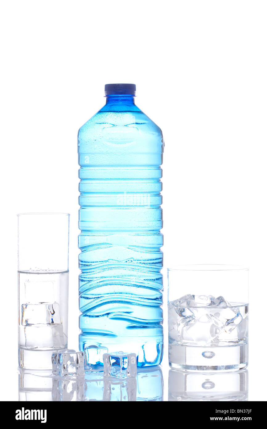 Bottle and glasses of mineral water with ice cubes reflected on white background Stock Photo - Alamy