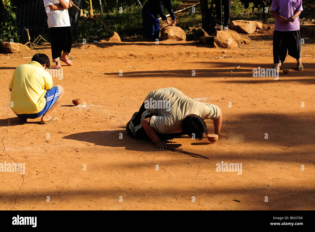 Children playing spinning tops hi-res stock photography and images - Alamy