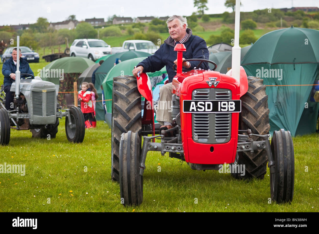 Farmer driving a vintage Massey Ferguson 35X tractor at a Scottish ...