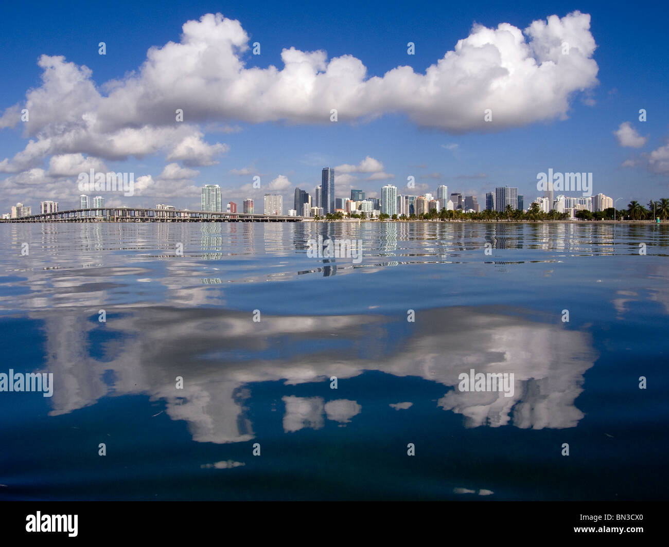 Downtown skyline with clouds reflect in calm Biscayne Bay off Virginia ...