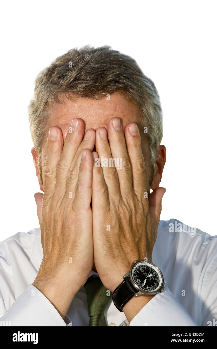 Man holding hands in front of face Stock Photo - Alamy