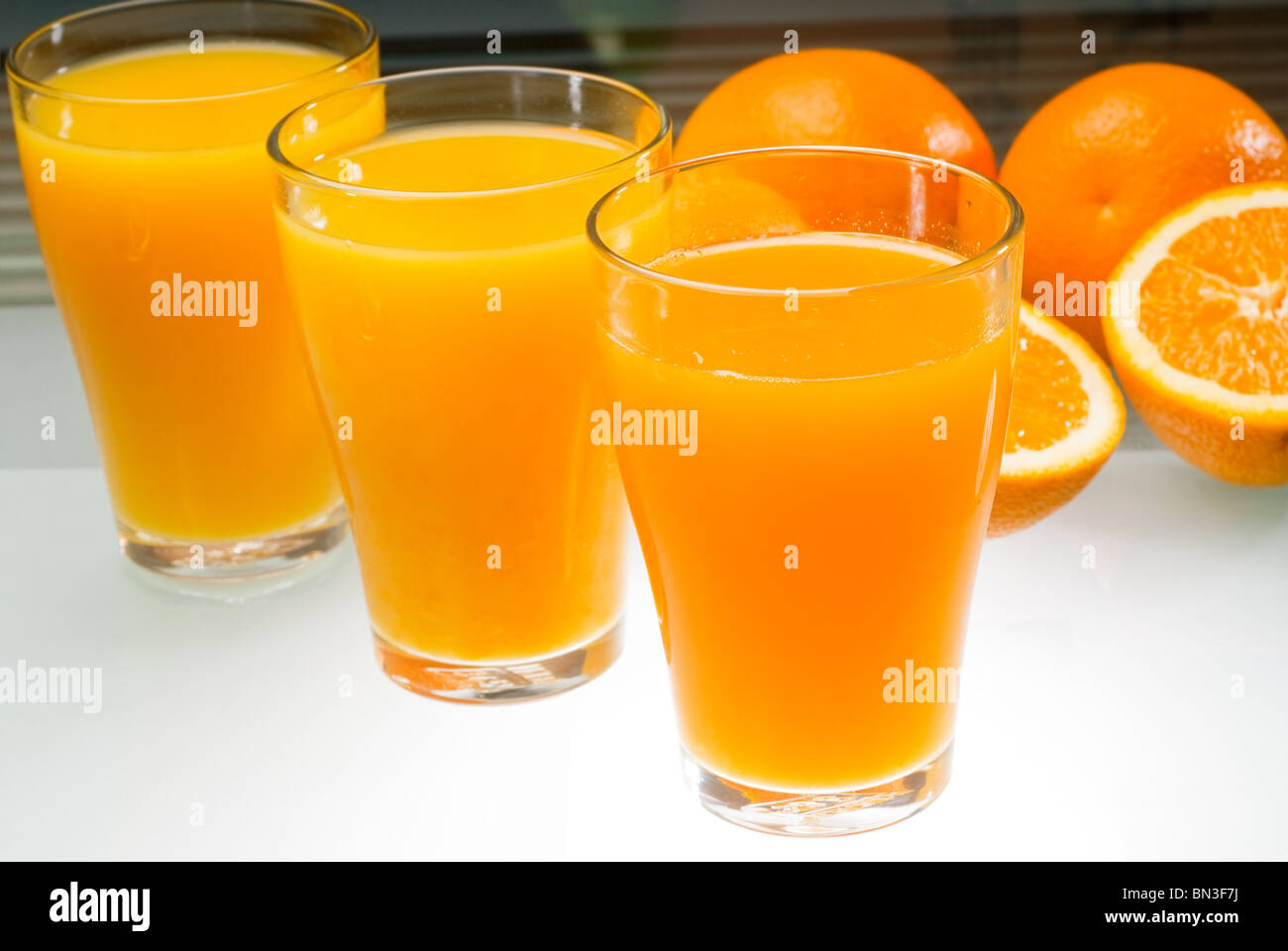 fresh and healthy orange juice ,unfiltered ,over a light table Stock ...
