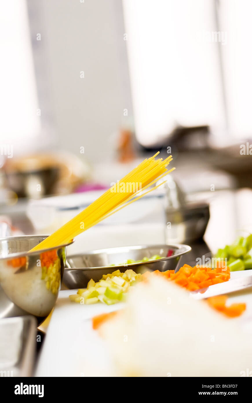 italian spaghetti pasta on a typical full equipped restaurant kitchen ...