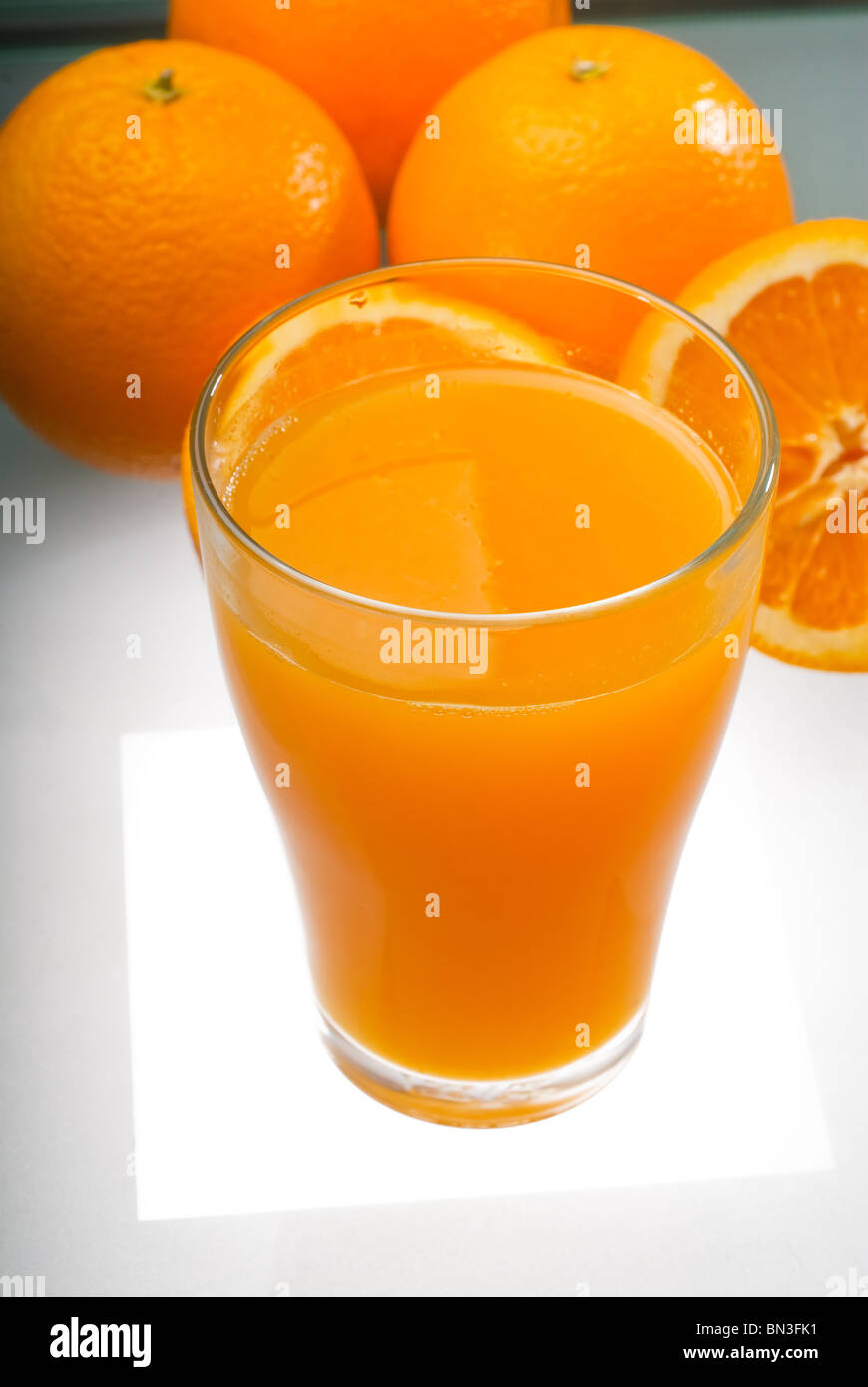 fresh and healthy orange juice ,unfiltered ,over a light table Stock ...