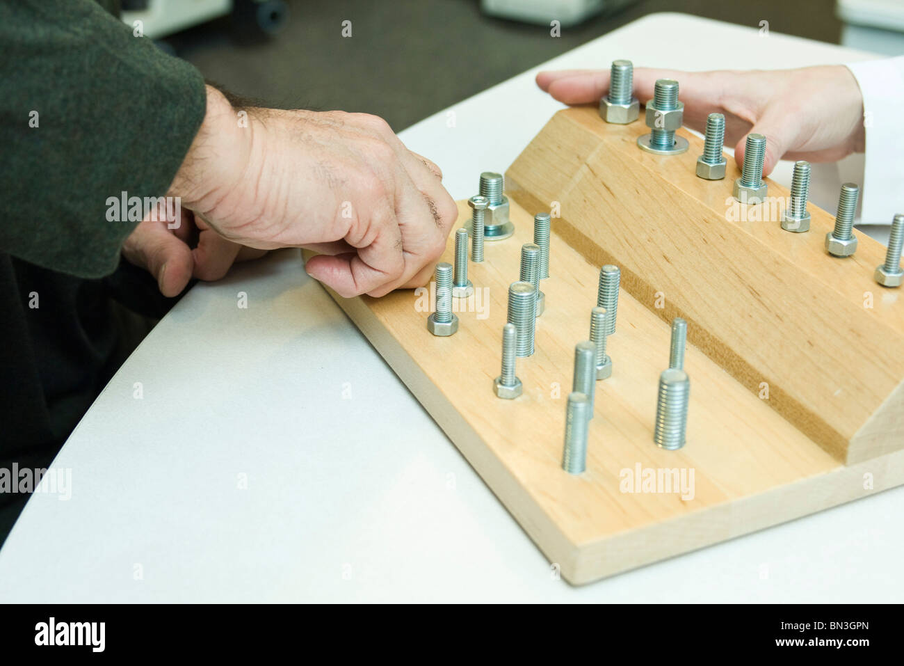 Using therapeutic tool for improving fine motor and sensory function ...