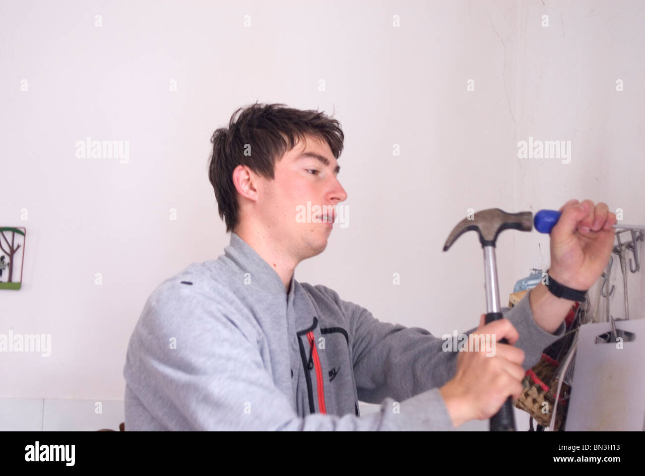 Young man doing DIY Stock Photo - Alamy
