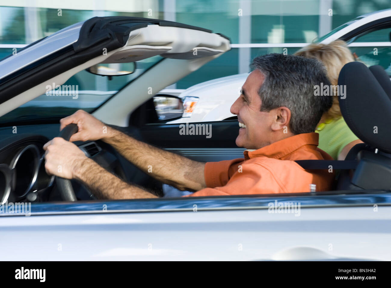 Mature man enjoying driving convertible Stock Photo - Alamy