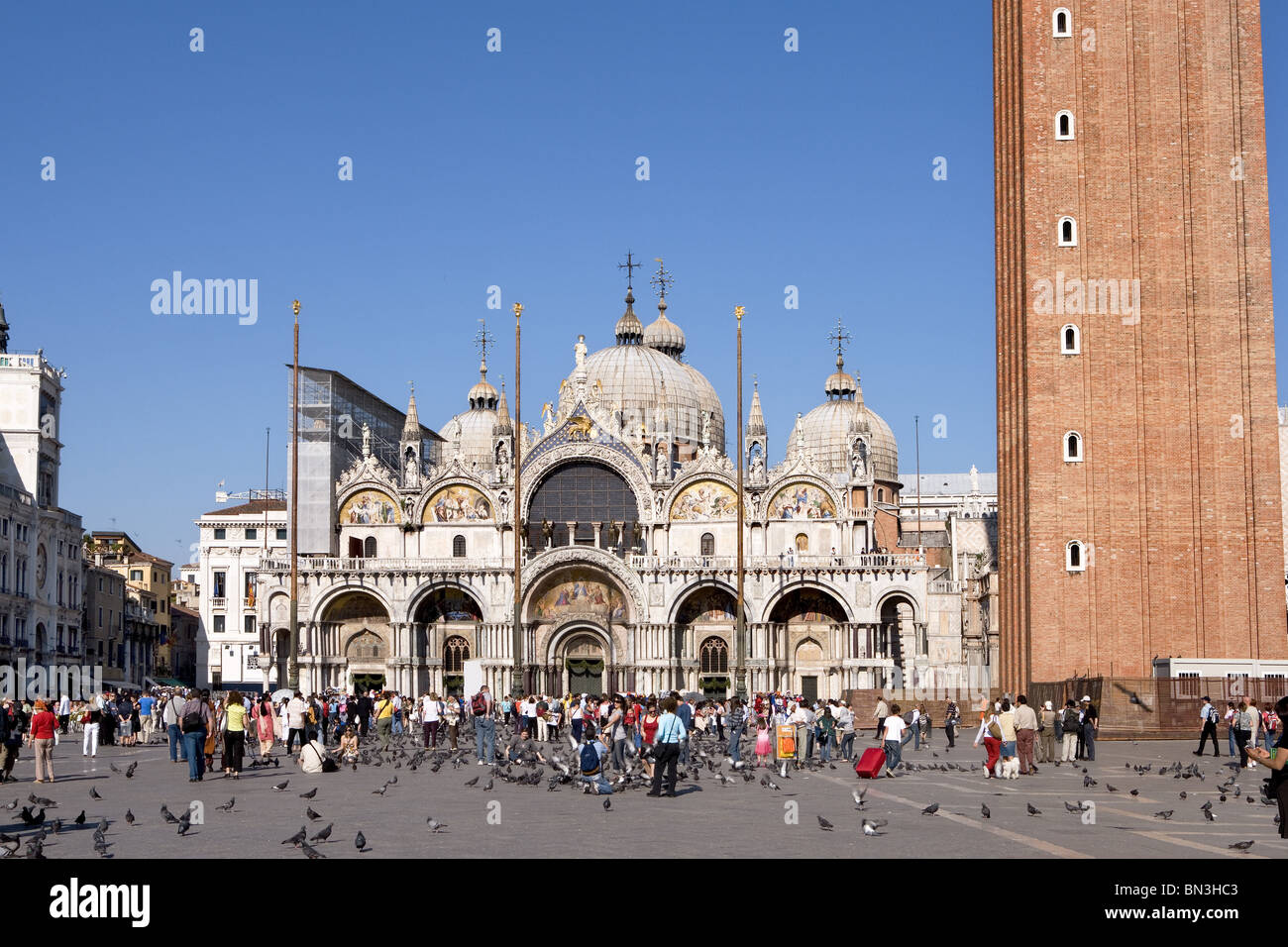 Tourists on St Marks Square in front of the Basilica of San Marco ...