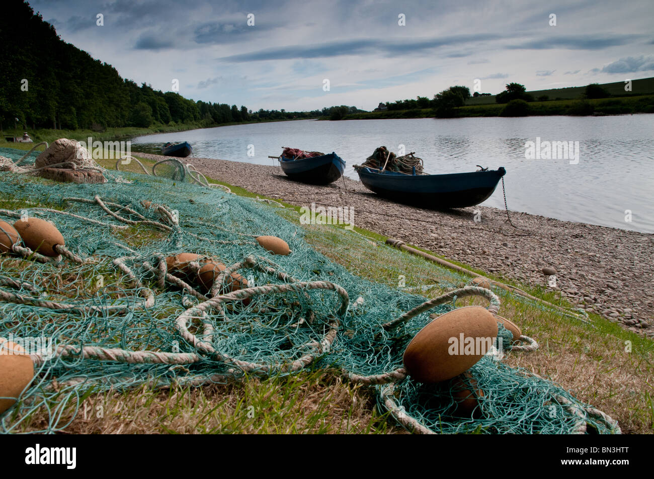 Salmon net boat or coble on the River Tweed Stock Photo - Alamy