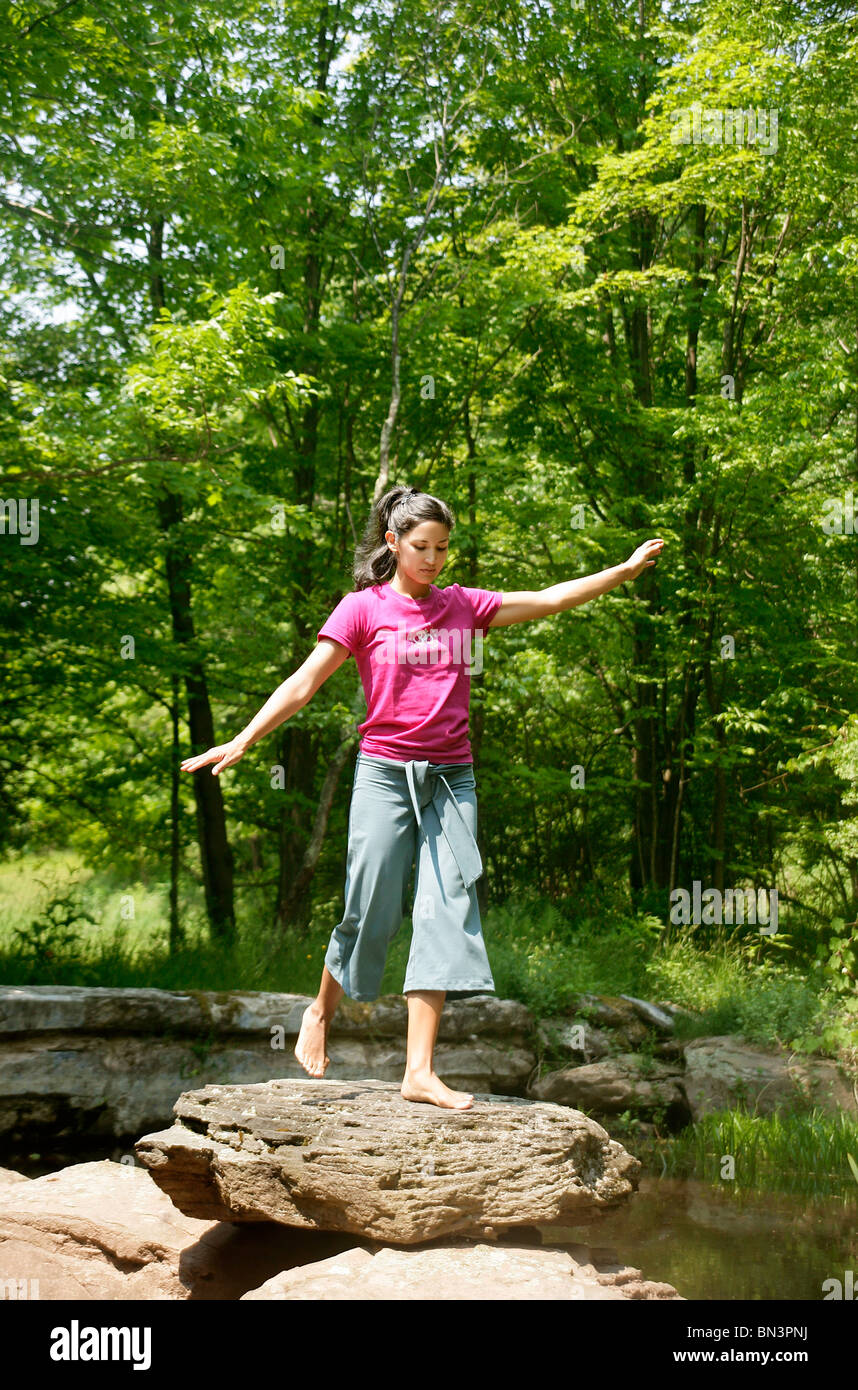 Woman balancing on a rock hi-res stock photography and images - Alamy