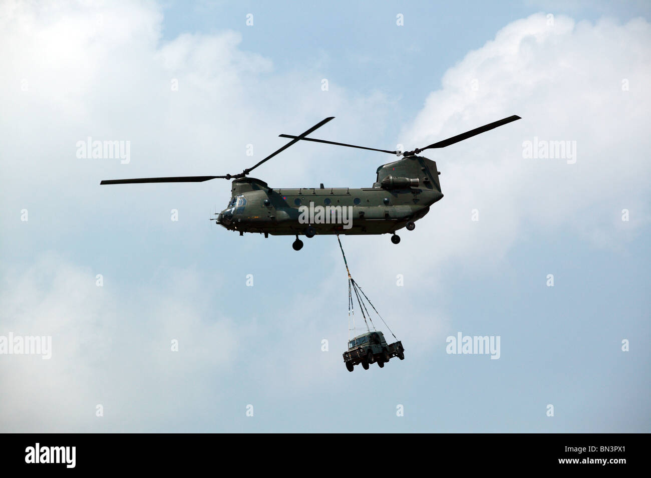 RAF Chinook HC.2 carrying an underslung Landrover and Trailer combo ...