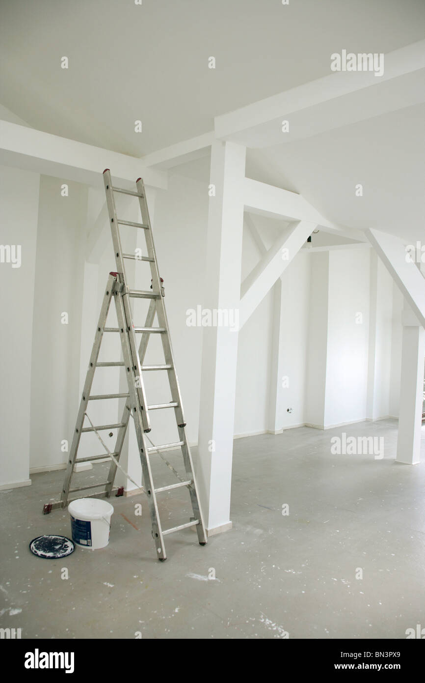 Ladder and paint bucket in an empty attic flat Stock Photo - Alamy