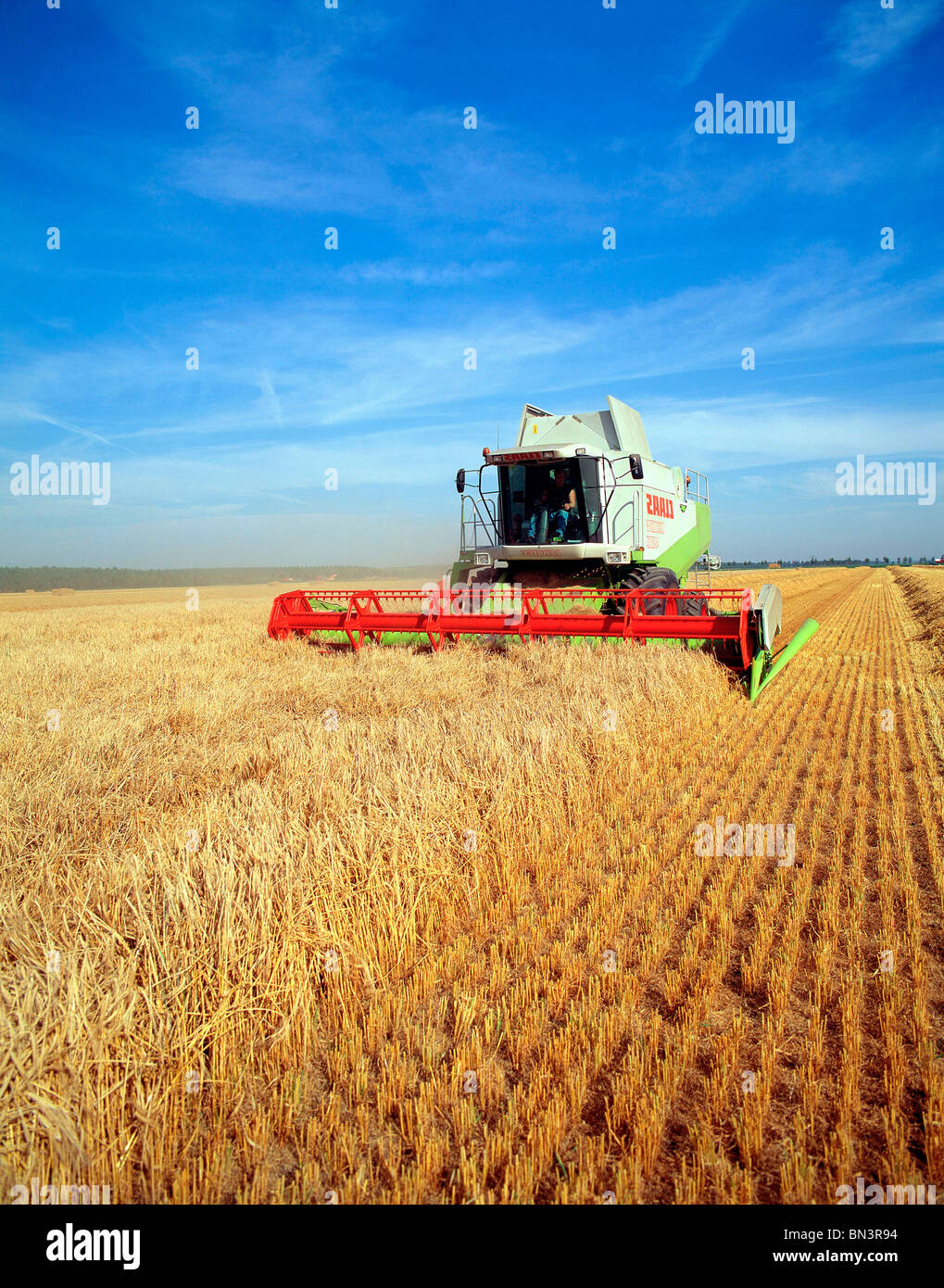 Combine harvester in field Stock Photo - Alamy