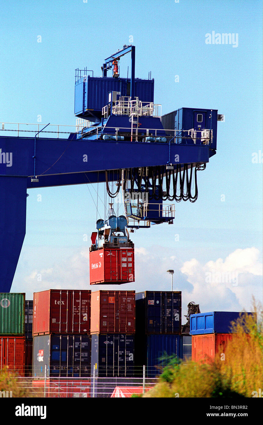 Crane lifting container at harbor Stock Photo - Alamy