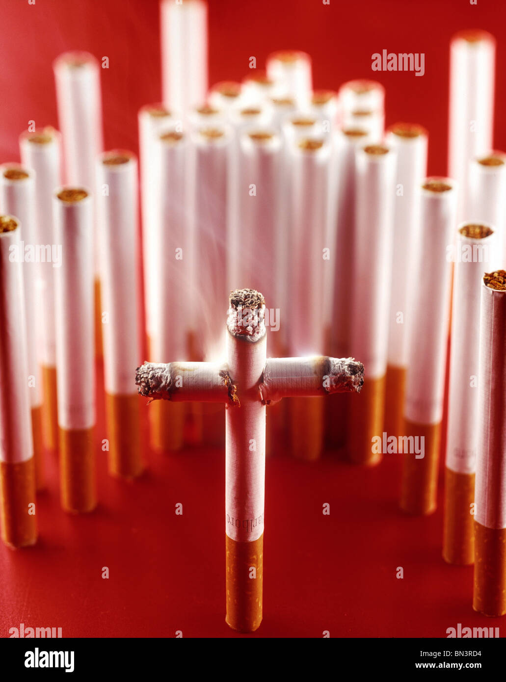 Close-up of cross made by cigarettes Stock Photo - Alamy