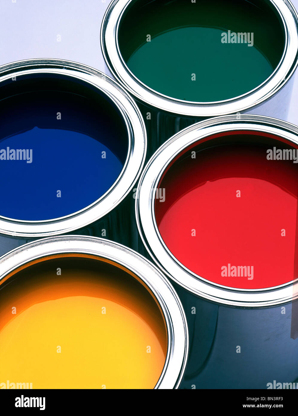 Close-up of four paint cans Stock Photo - Alamy