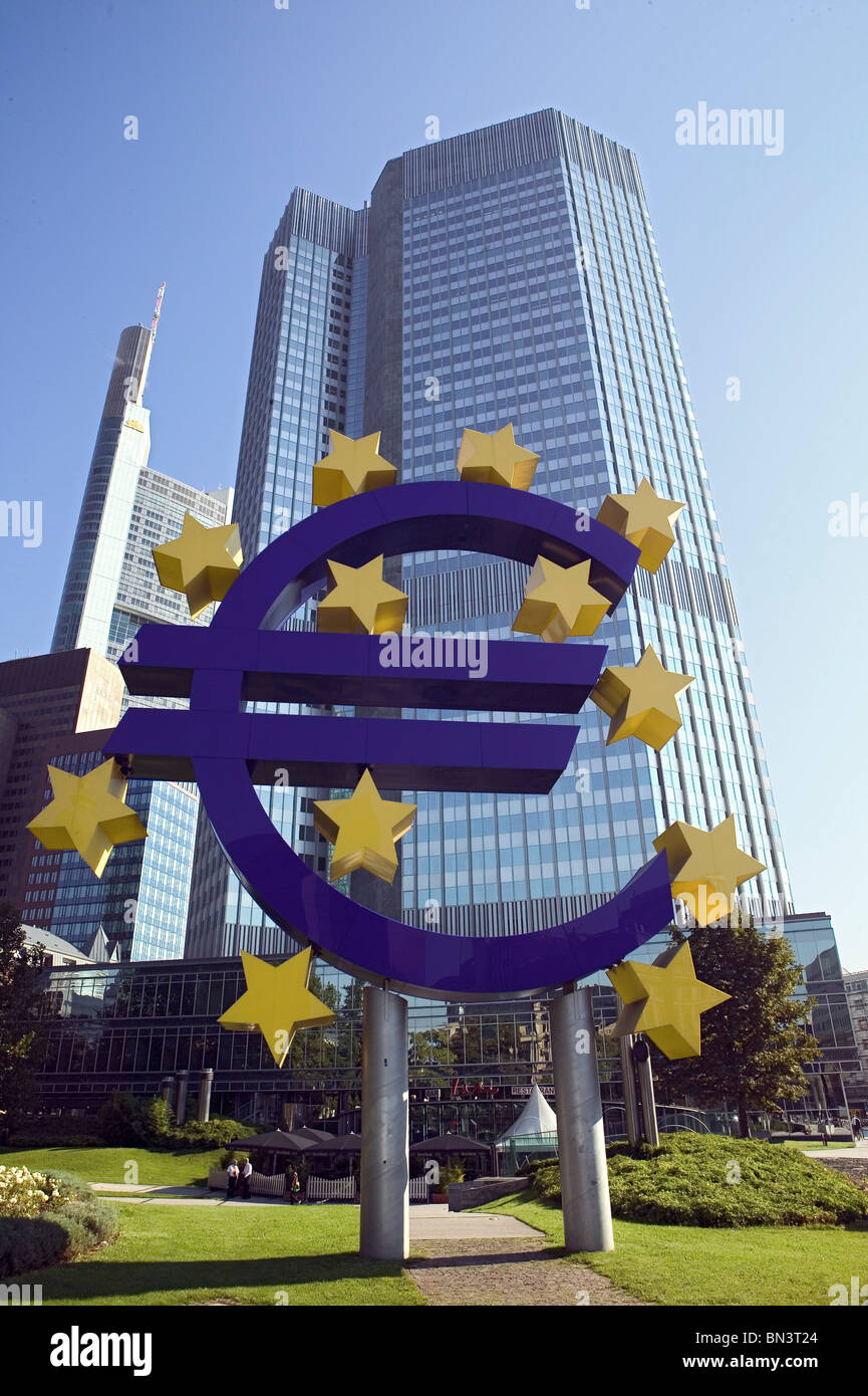 Euro sign in front of skyscraper Stock Photo - Alamy