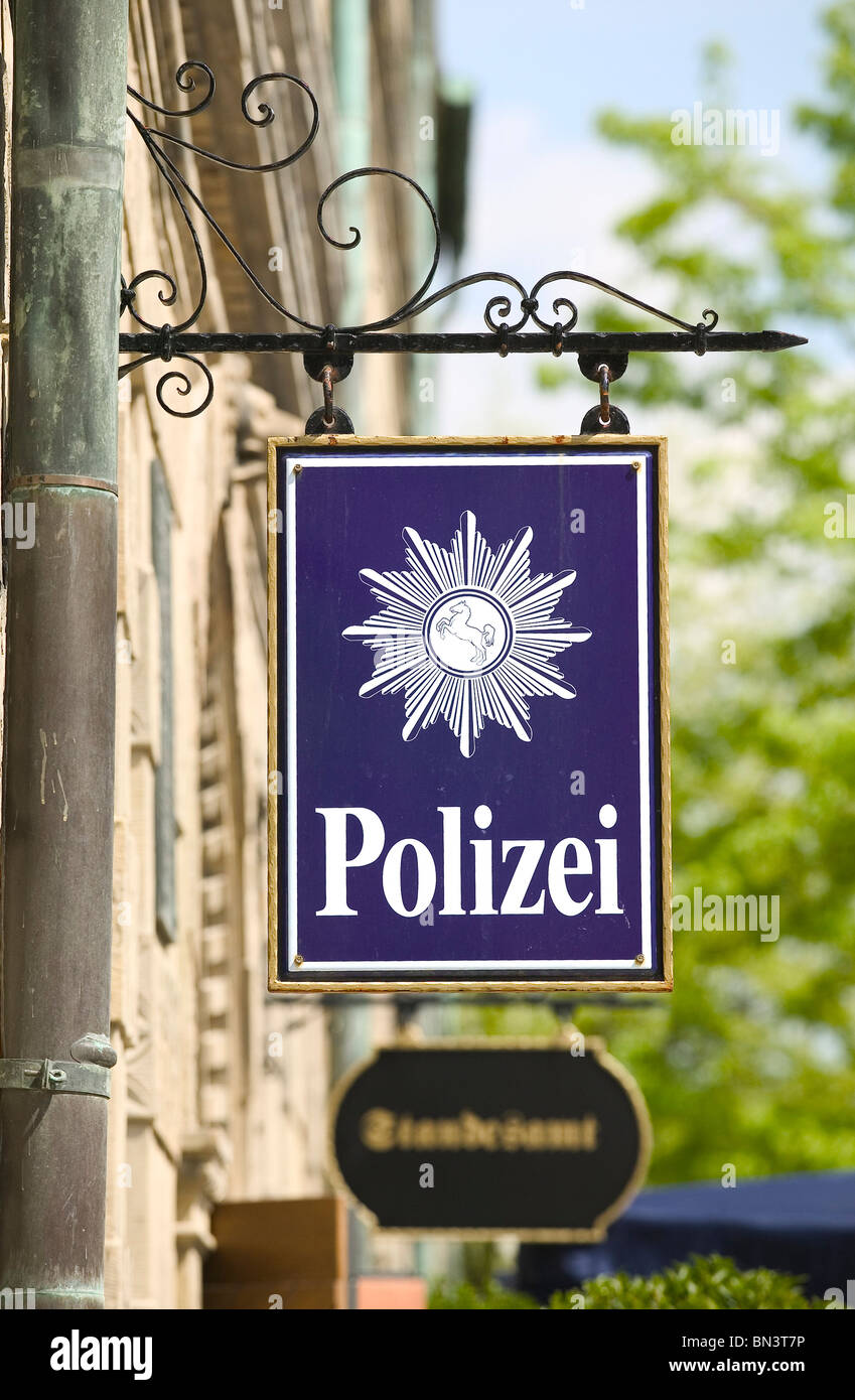Police signboard hanging on iron bar Stock Photo - Alamy