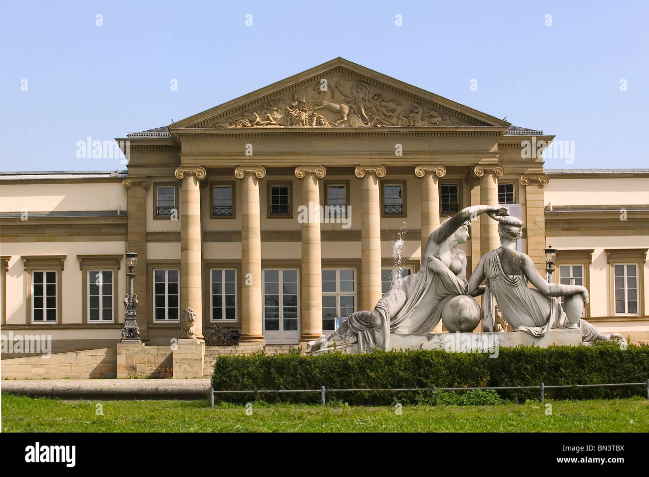 Statues in front of building Stock Photo - Alamy