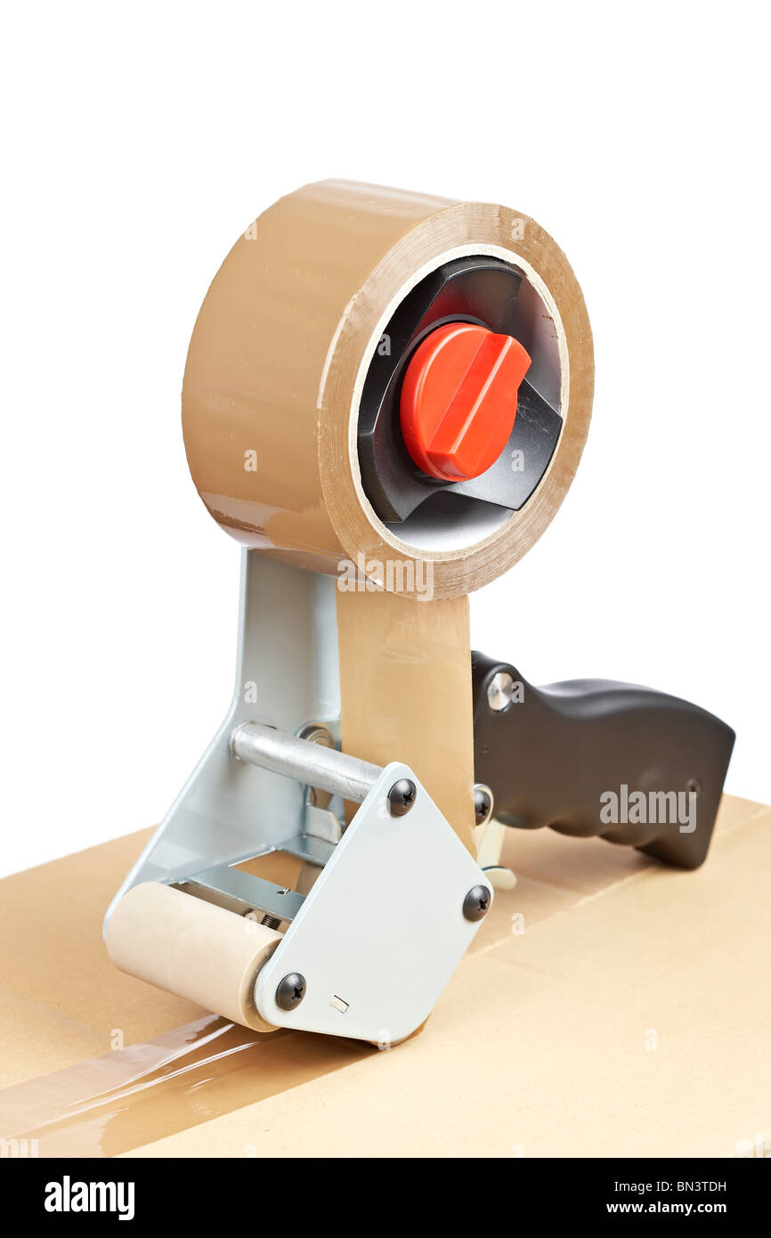 Packaging tape dispenser and shipping box isolated on white background ...