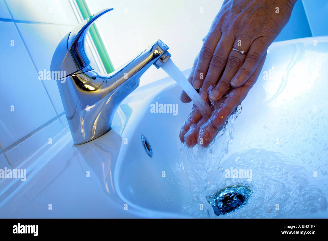 Close-up of person washing hands Stock Photo - Alamy