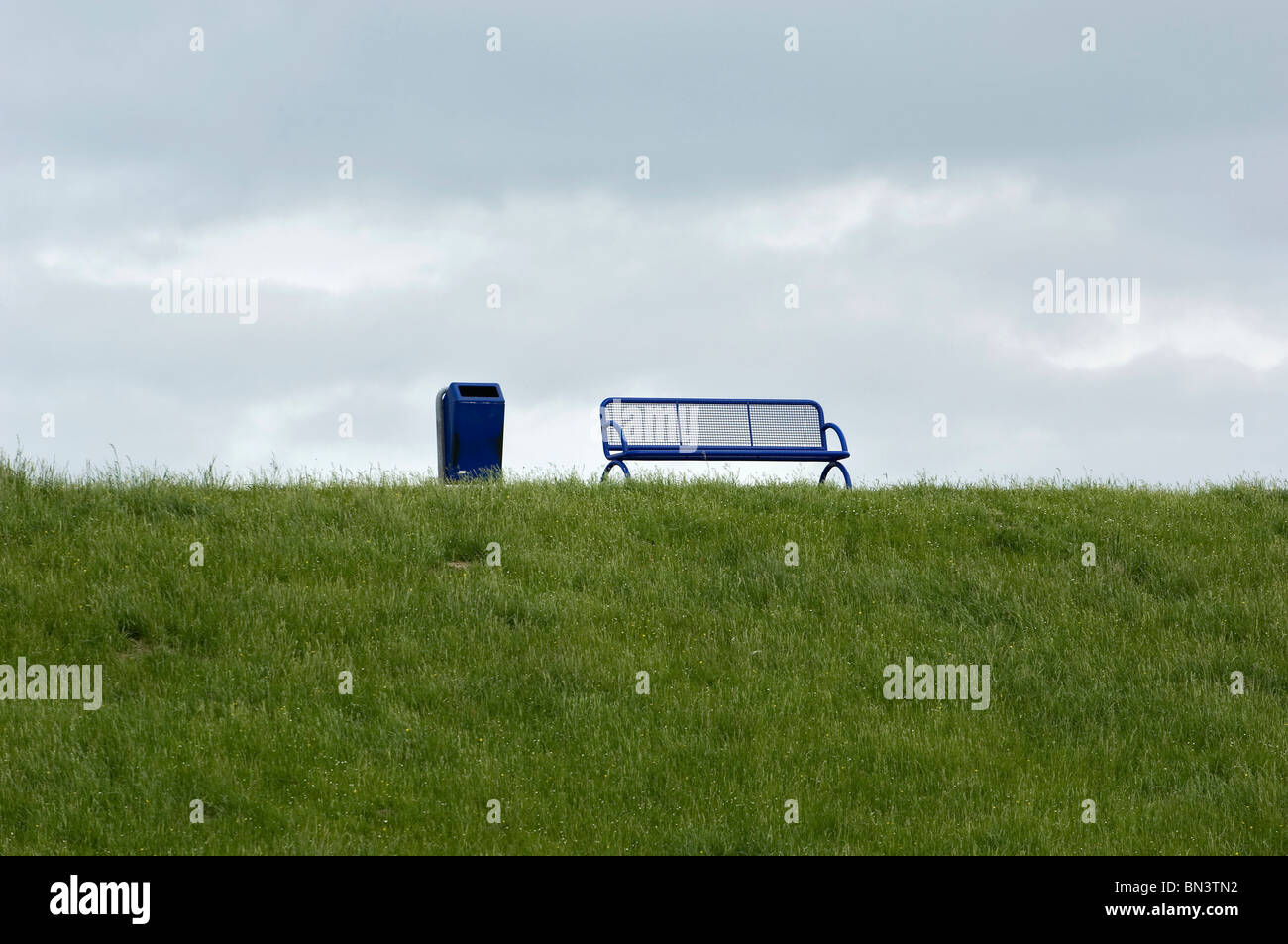 Bench and dustbin in park Stock Photo - Alamy