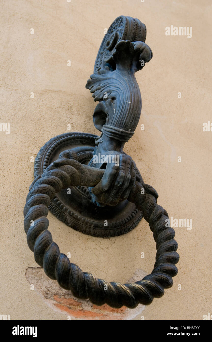 Hitching post on a wall in Siena, Tuscany Stock Photo - Alamy