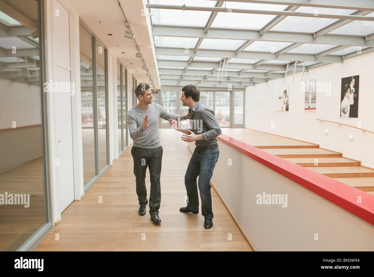 two men giving high five Stock Photo - Alamy