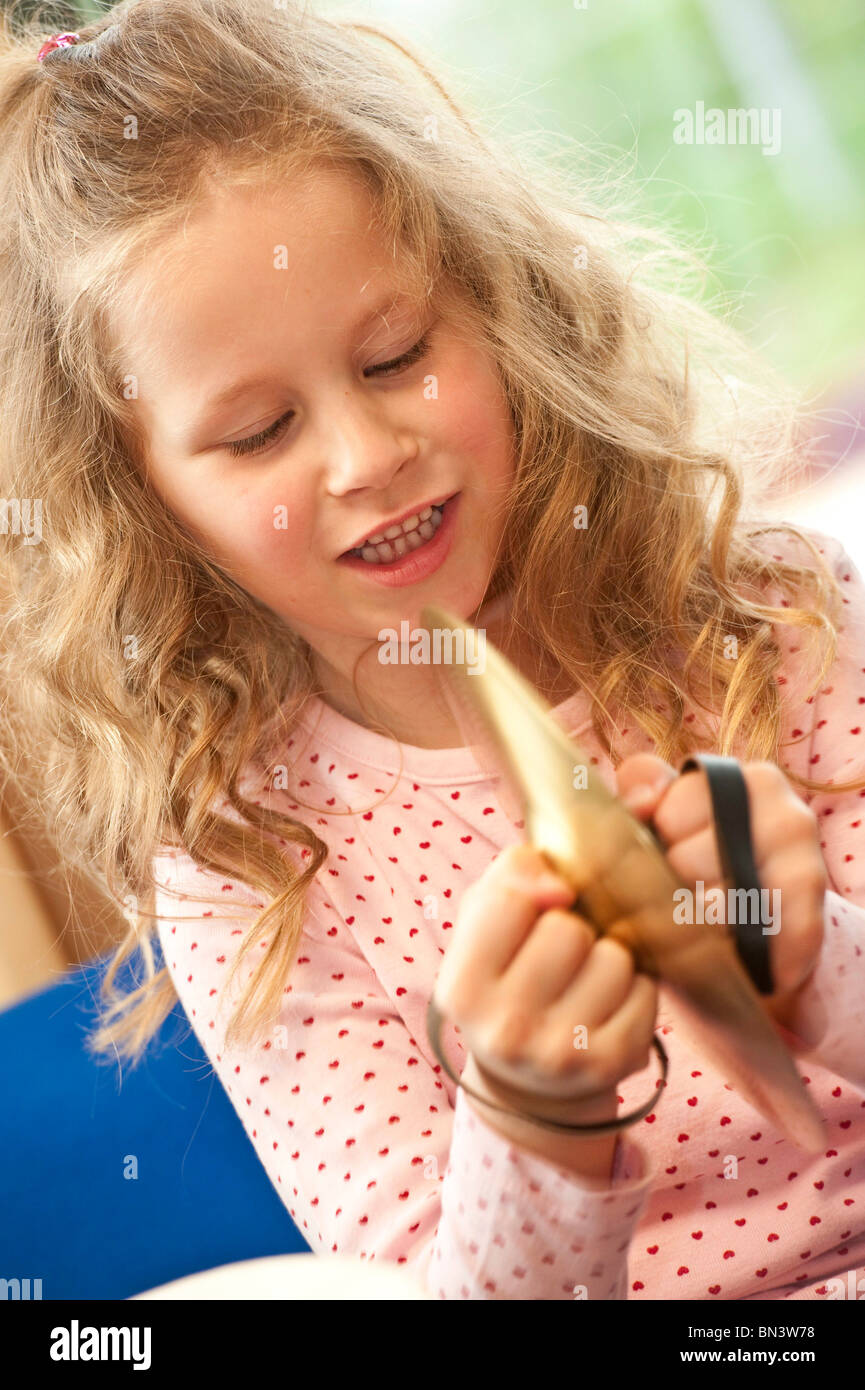 Young girl making music with cymbals Stock Photo - Alamy